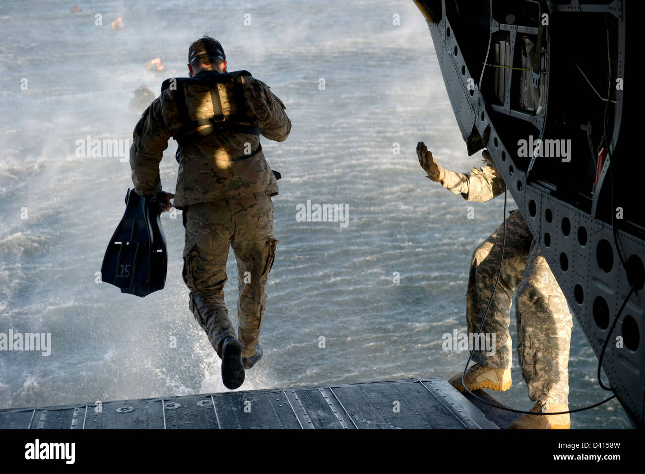 US Green Beret Special Forces soldiers exits out the back of a CH-47 ...