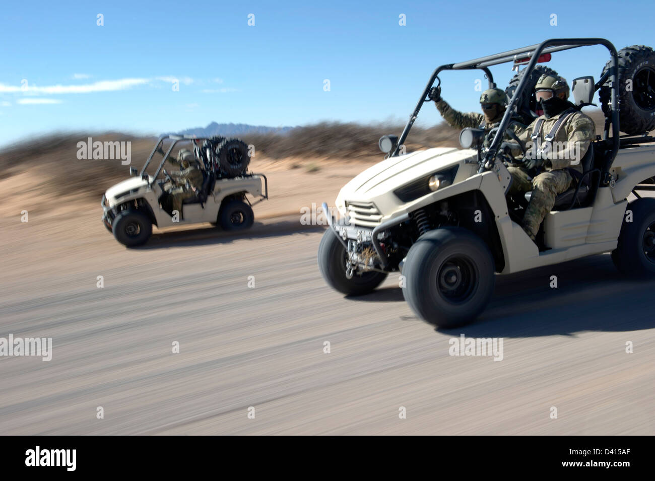 US Green Beret Special Forces soldiers perform off-road maneuvers with ...