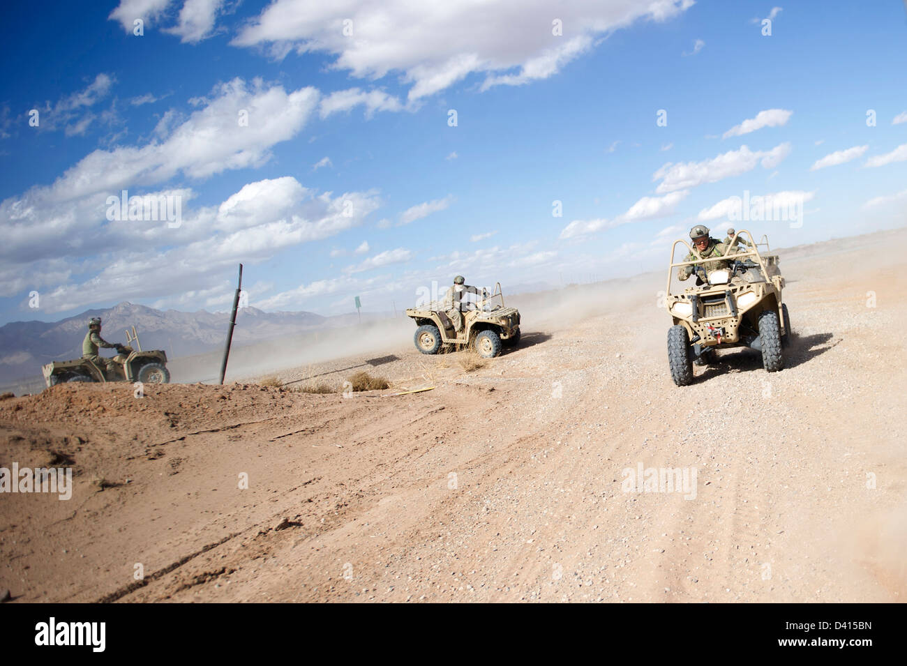 US Green Beret Special Forces soldiers perform off-road maneuvers with ...