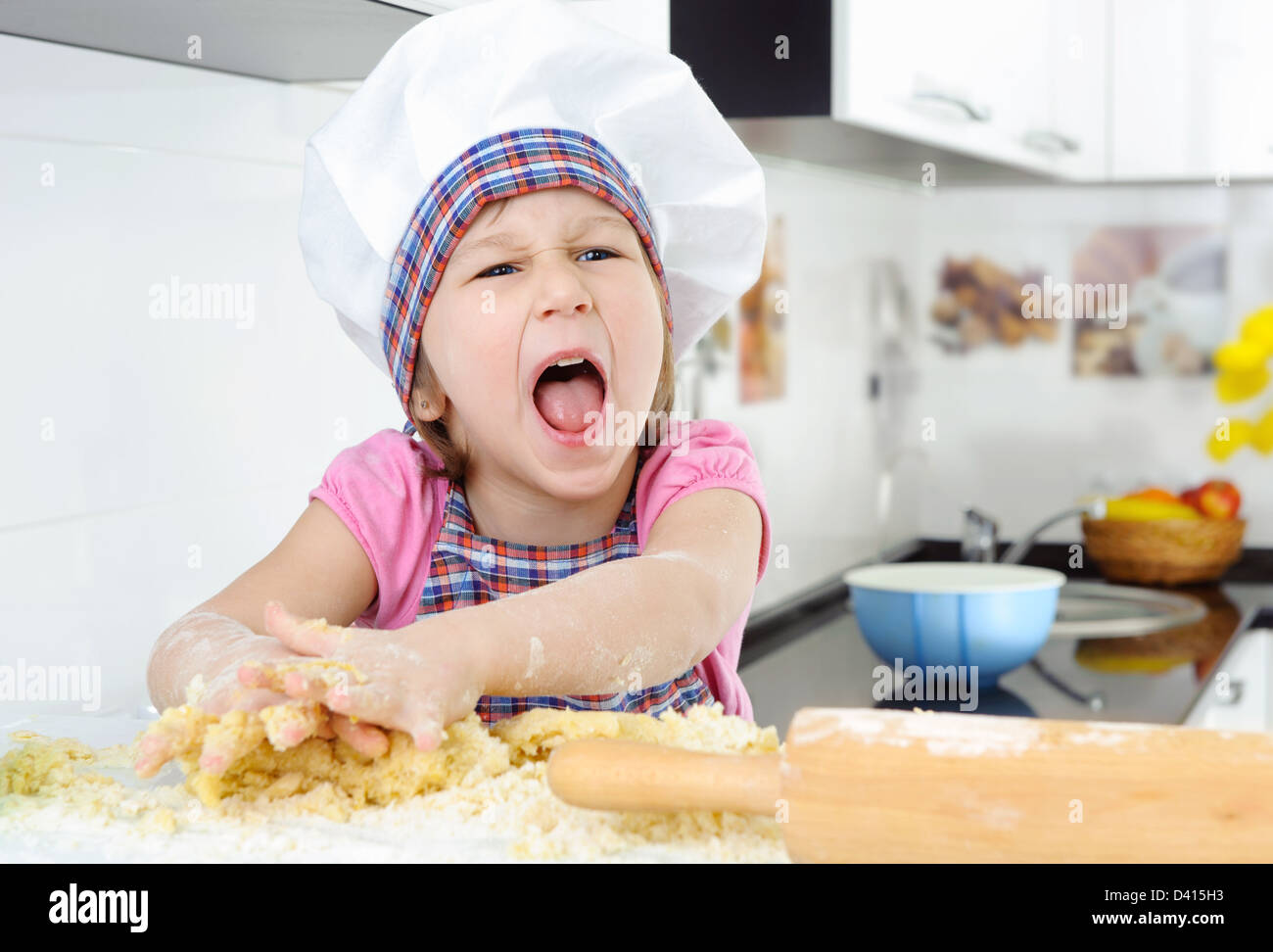 Little angry baker screaming in the kitchen Stock Photo - Alamy
