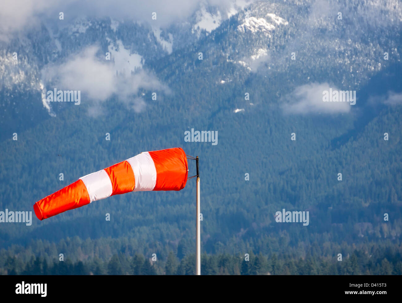 Wind cone against a mountain background Stock Photo - Alamy
