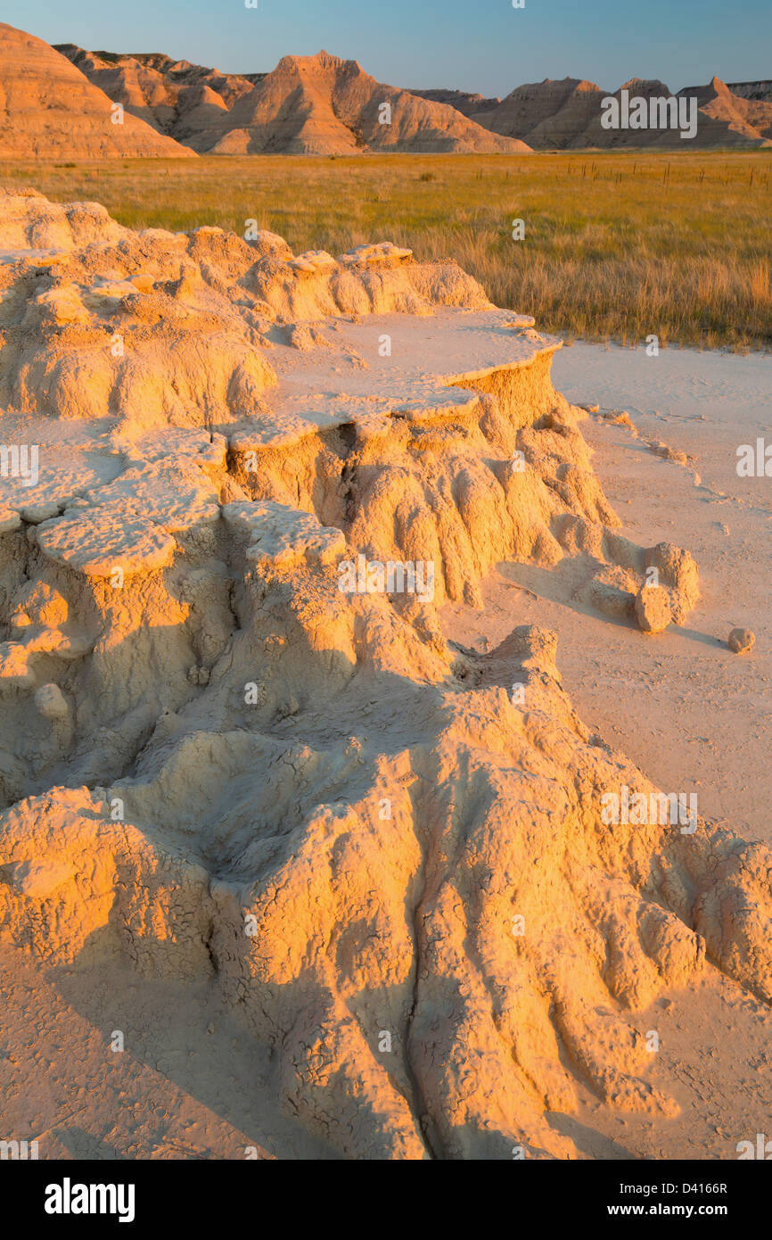 The prairie meets the Badlands at sunset in Badlands National Park ...