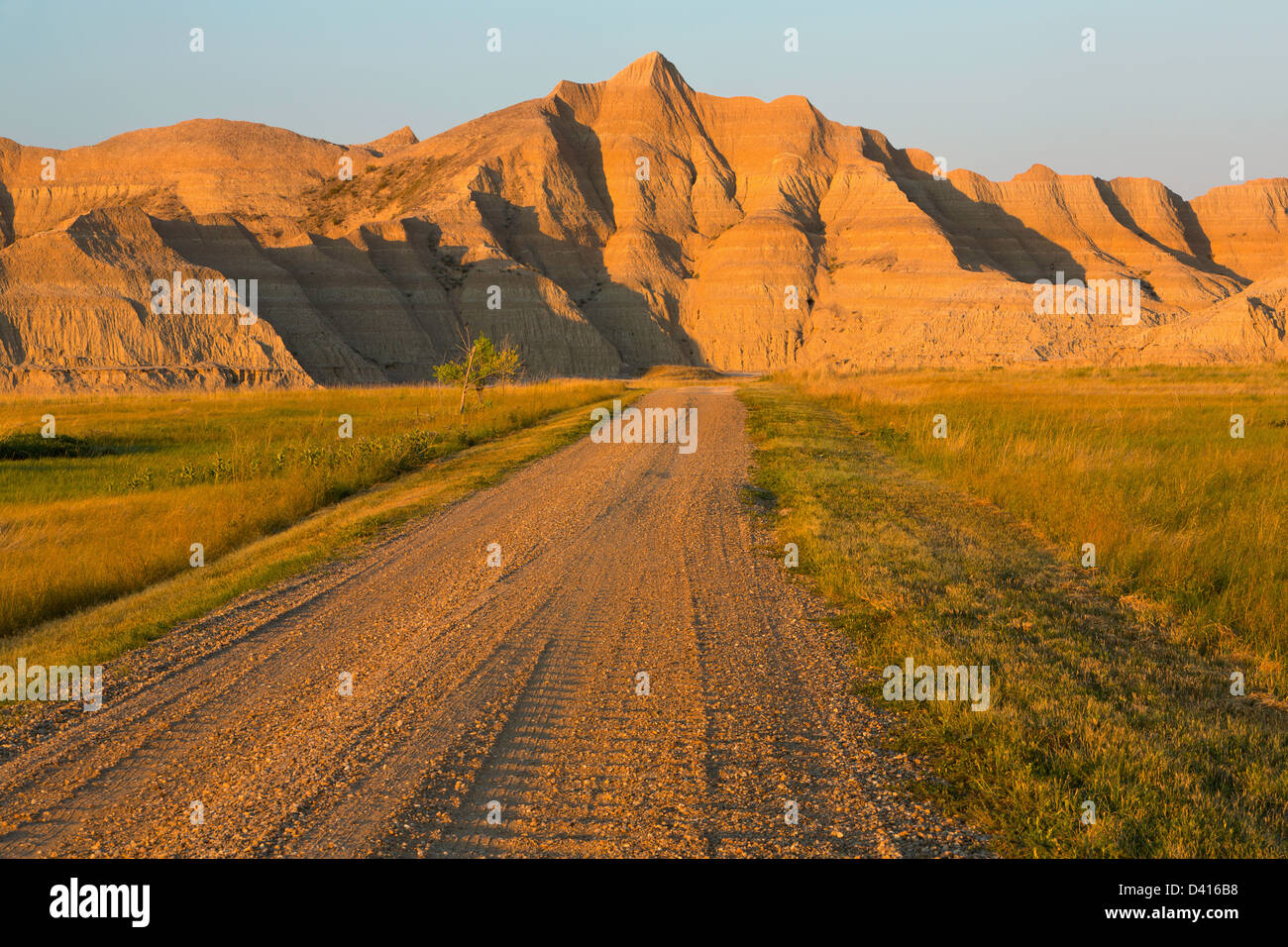 The prairie meets the Badlands at sunset in Badlands National Park ...