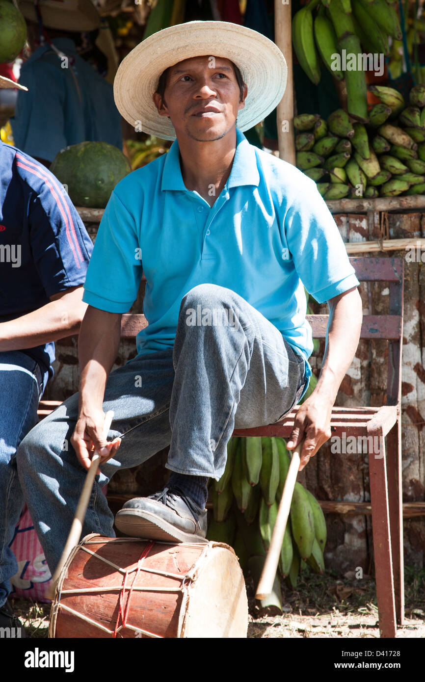 Ngobe Bugle Indian man playing a drum at the Festival de la Naranja in ...