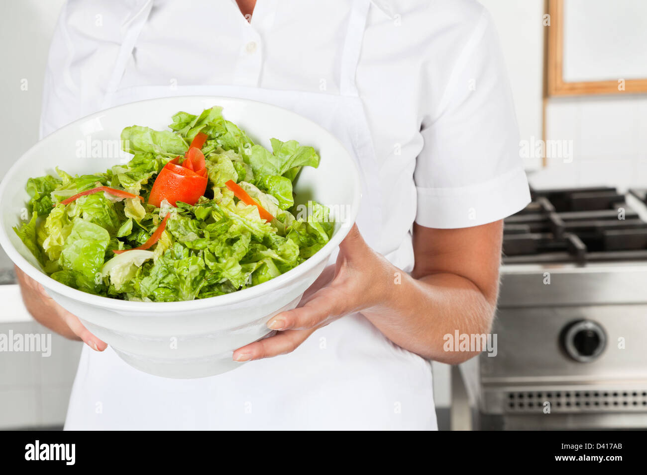 Female Chef Presenting Salad Stock Photo - Alamy