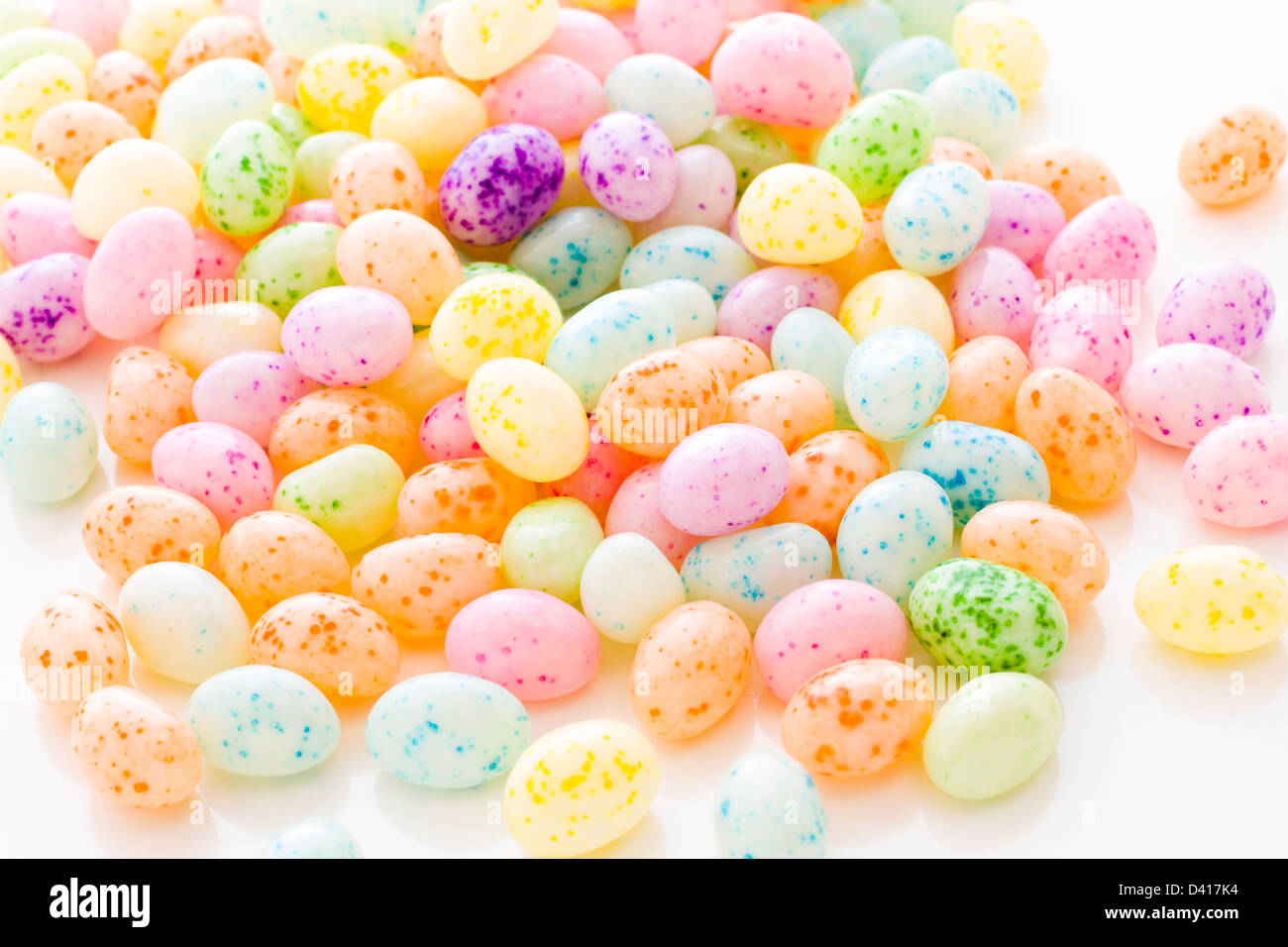 Assorted jelly beans in pastel colors with darker spots Stock Photo - Alamy