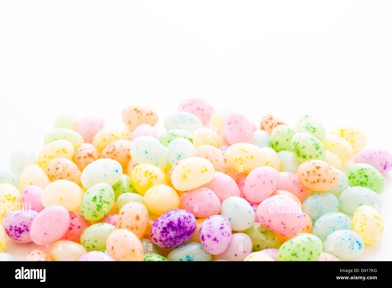 Assorted jelly beans in pastel colors with darker spots Stock Photo - Alamy