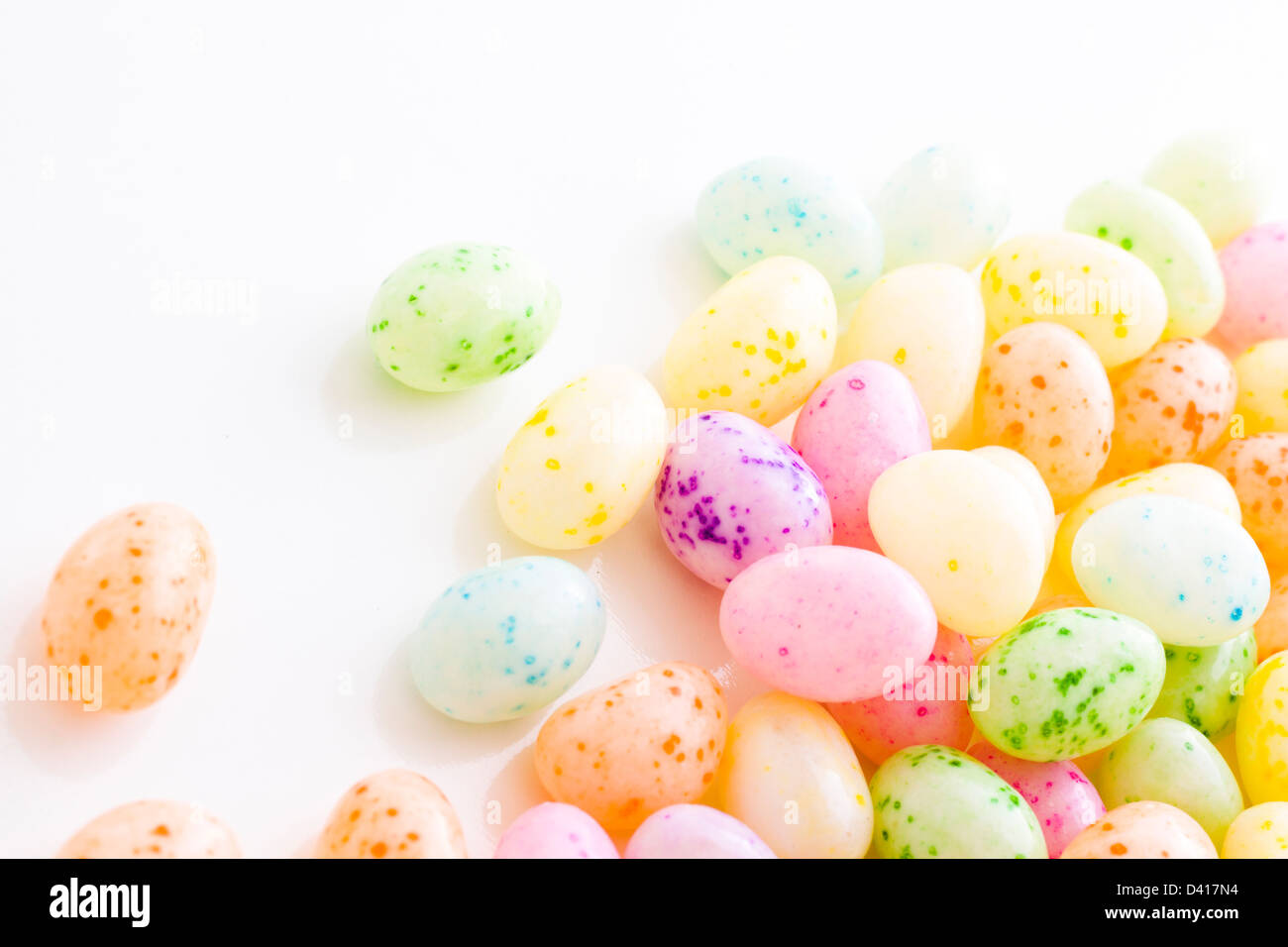Assorted jelly beans in pastel colors with darker spots Stock Photo - Alamy