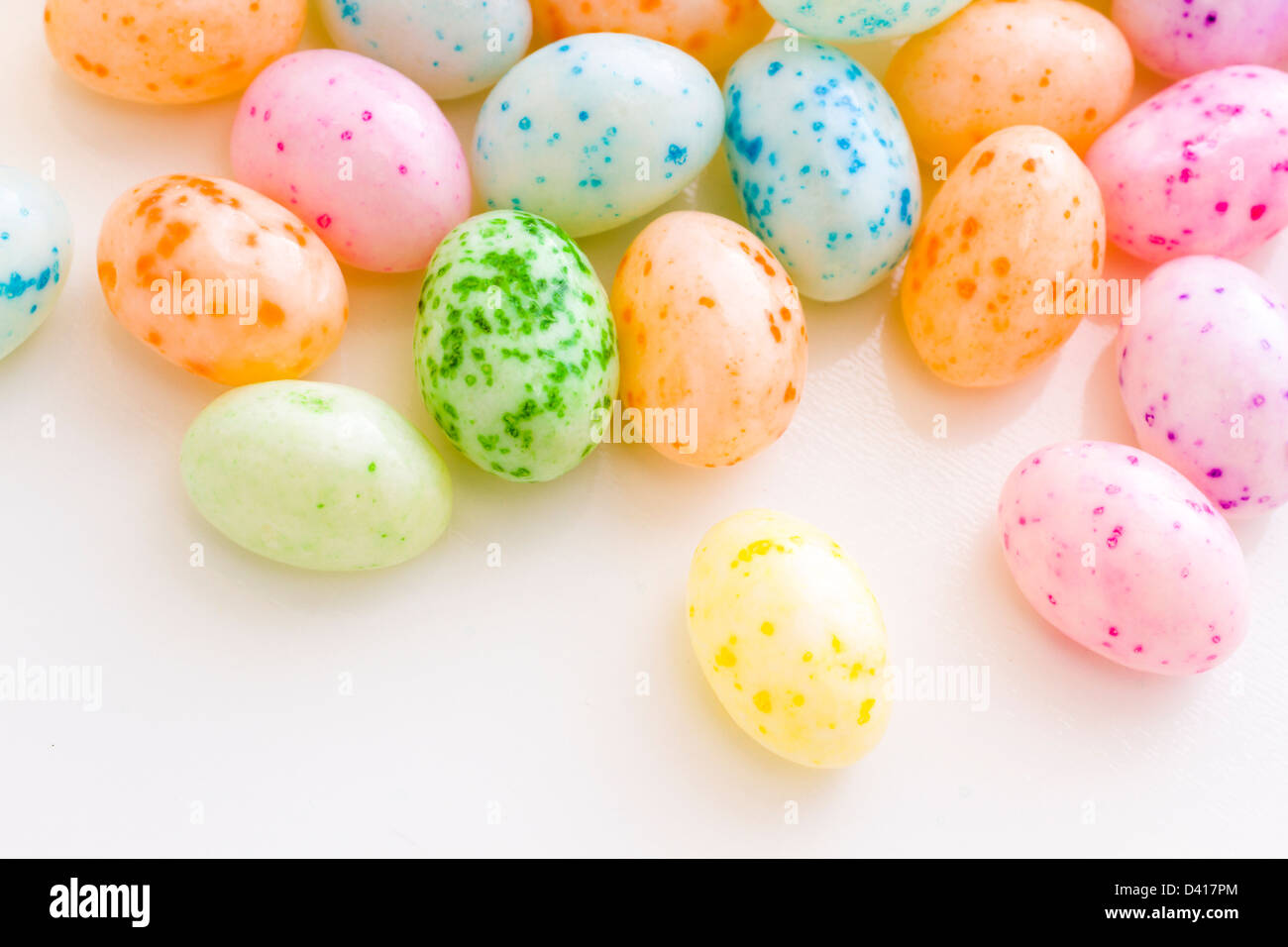 Assorted jelly beans in pastel colors with darker spots Stock Photo - Alamy