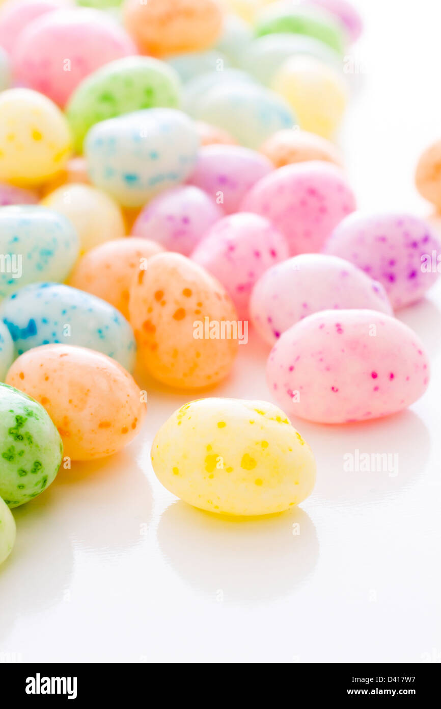 Assorted jelly beans in pastel colors with darker spots Stock Photo - Alamy