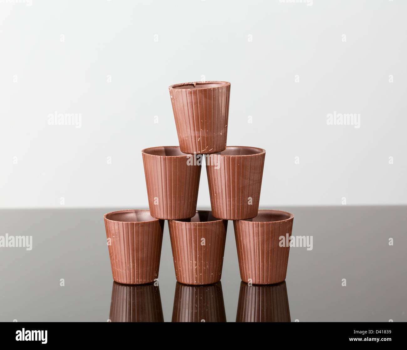 Stack of chocolate shot glasses in pyramid Stock Photo - Alamy