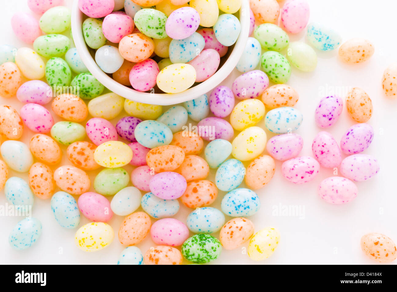 Assorted jelly beans in pastel colors with darker spots Stock Photo - Alamy