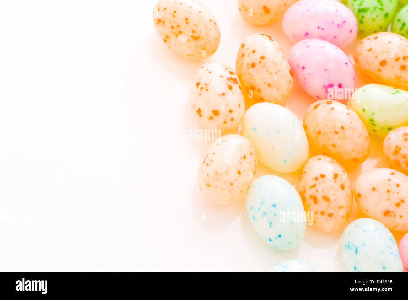 Assorted jelly beans in pastel colors with darker spots Stock Photo - Alamy