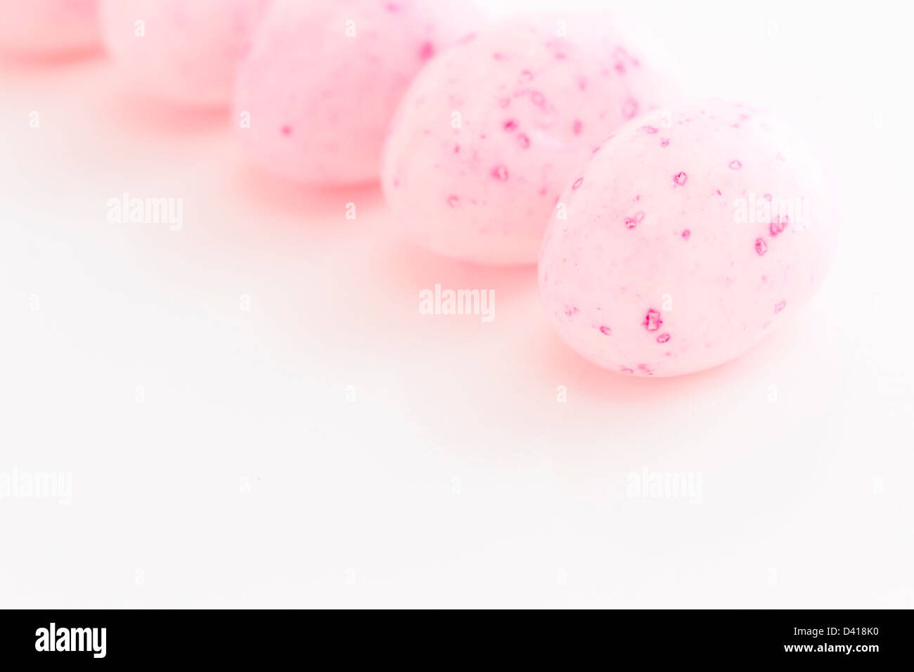 Assorted jelly beans in pastel colors with darker spots Stock Photo - Alamy