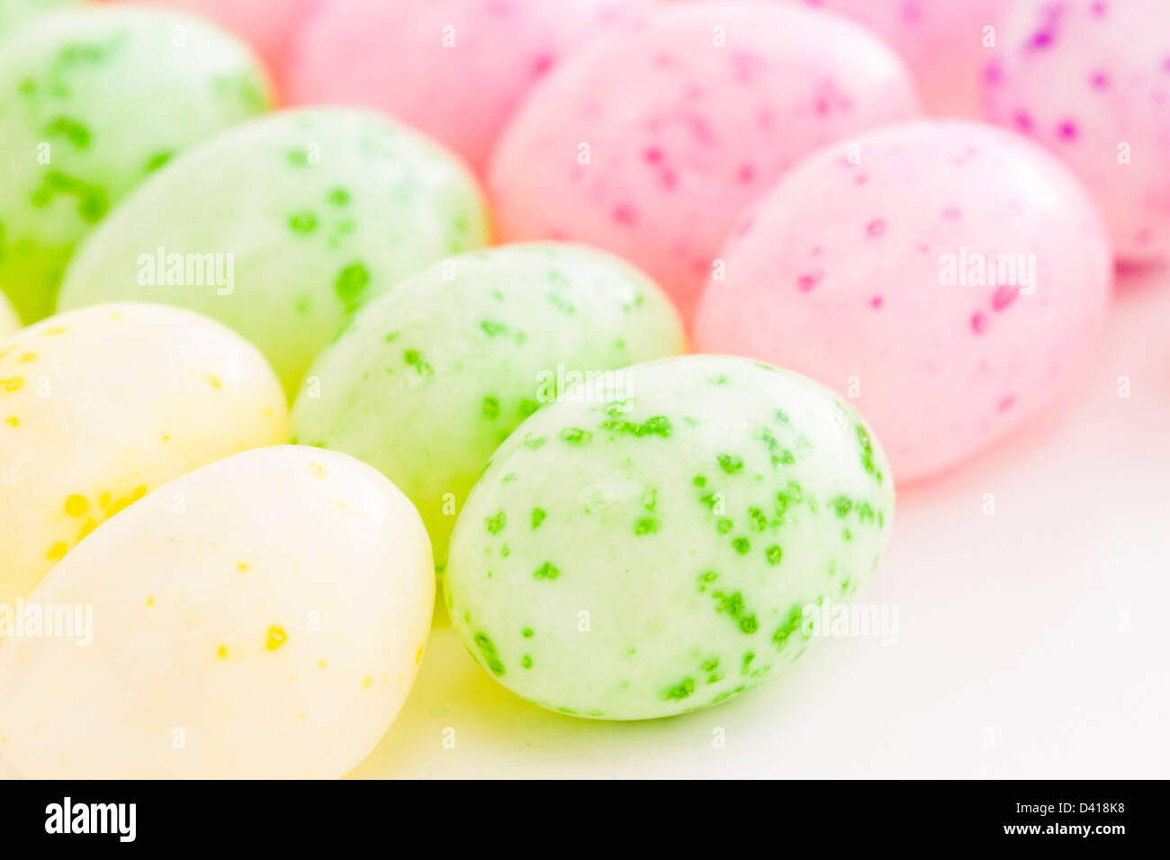 Assorted jelly beans in pastel colors with darker spots Stock Photo - Alamy