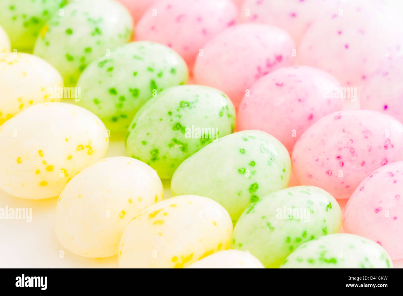 Assorted jelly beans in pastel colors with darker spots Stock Photo - Alamy