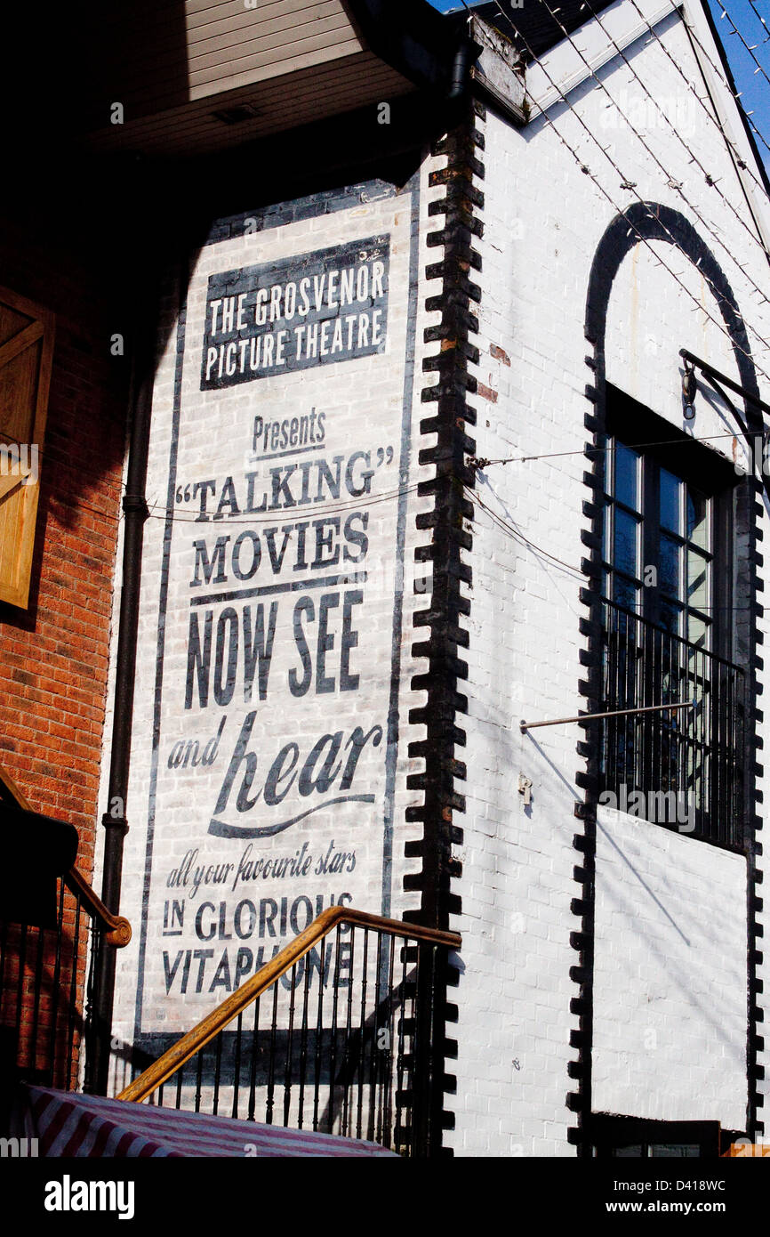 Talking Movies advertisement reproduced on cinema wall Stock Photo - Alamy