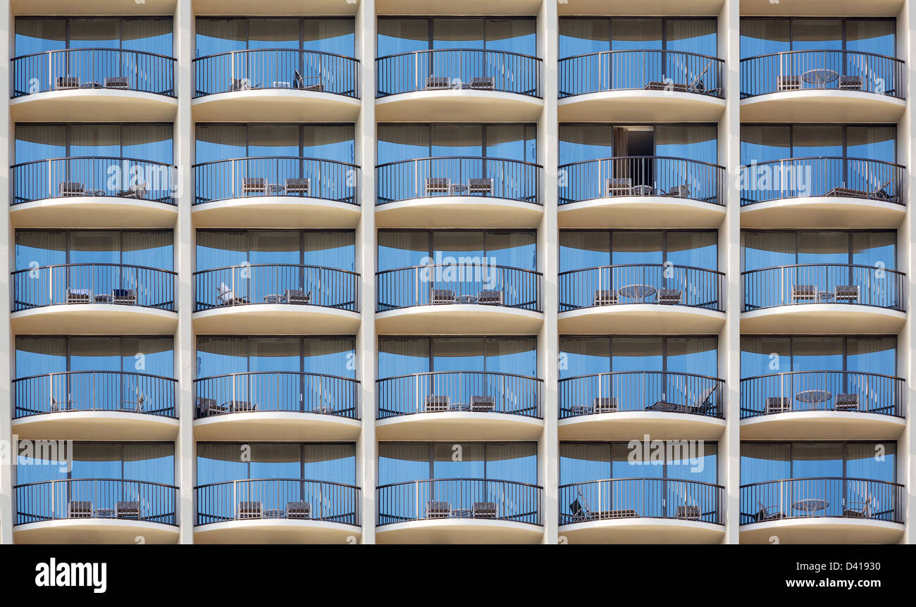 Pattern of hotel room balconies in modern building with one patio door ...