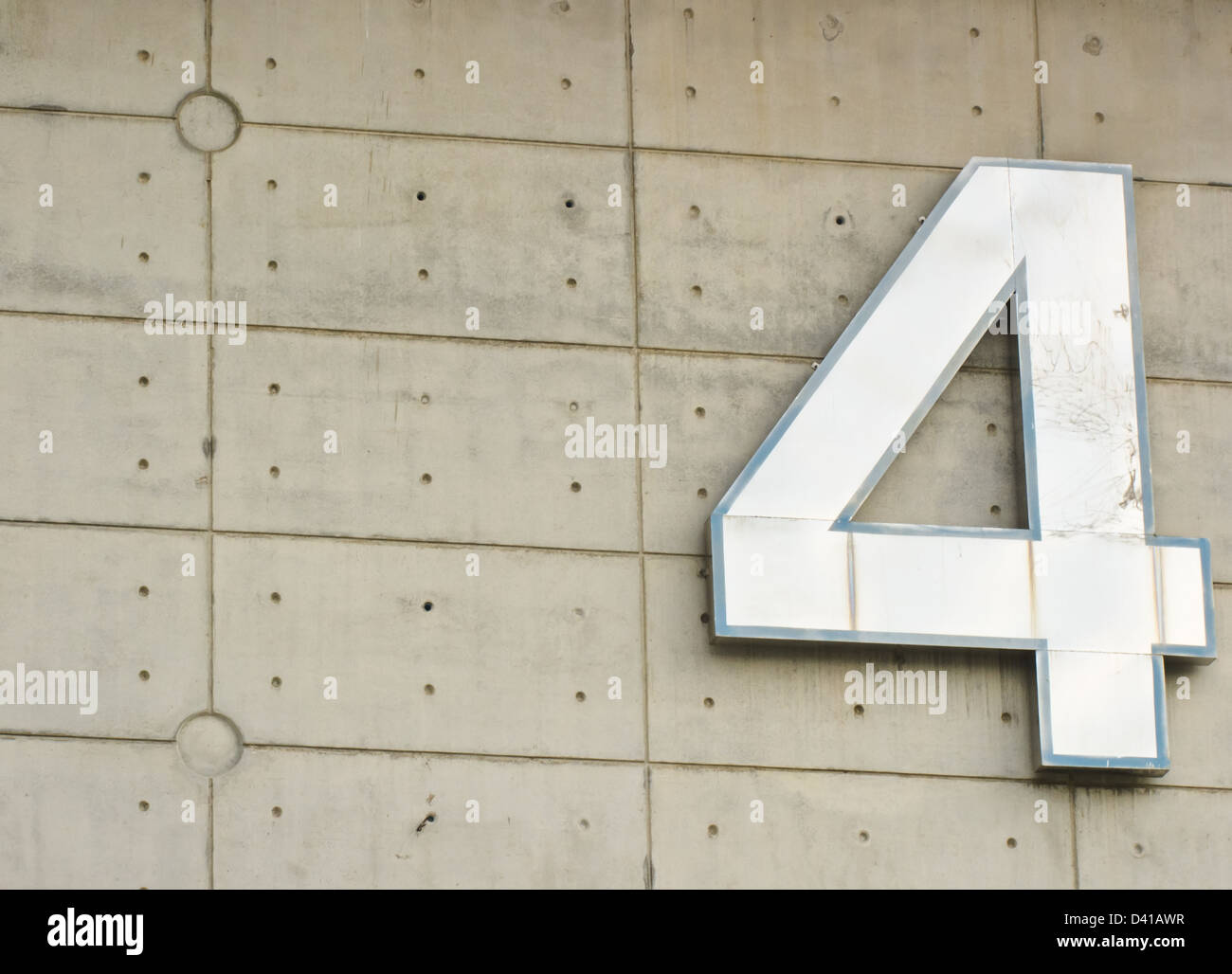 Number 4 on polished cement wall as background Stock Photo - Alamy