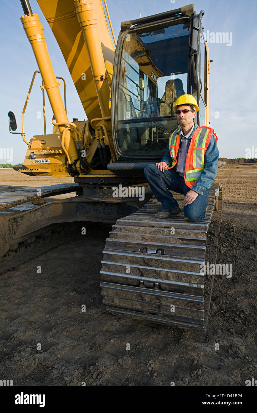 Middle age male grader operator Stock Photo - Alamy