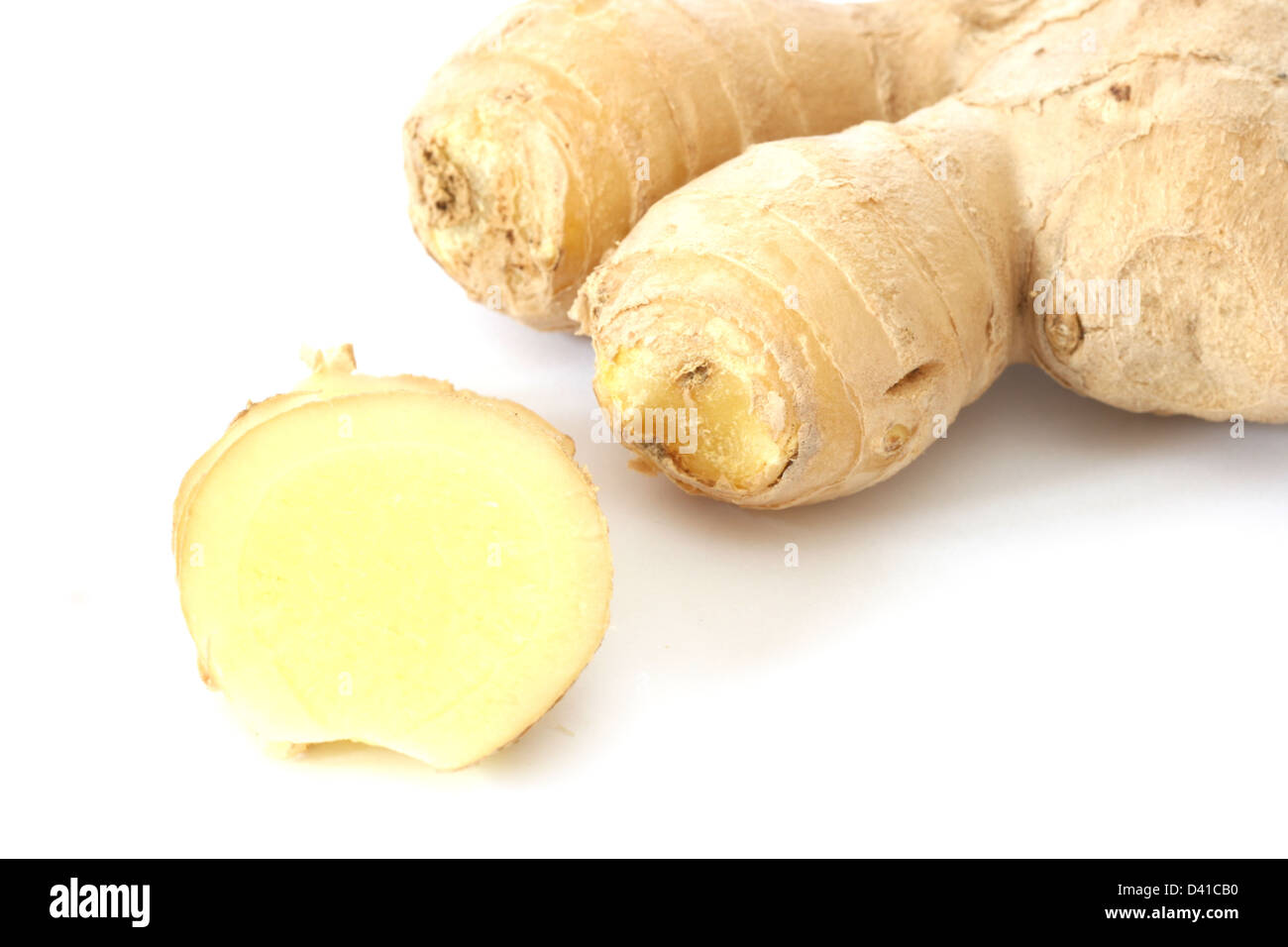 Whole raw ginger root piece on white background Stock Photo - Alamy