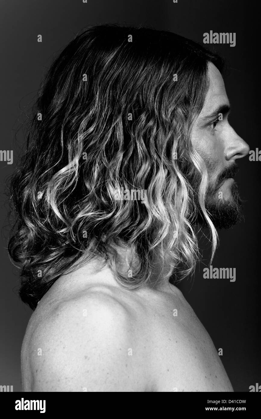 black and white side profile of a bare skinned Caucasian male with ...