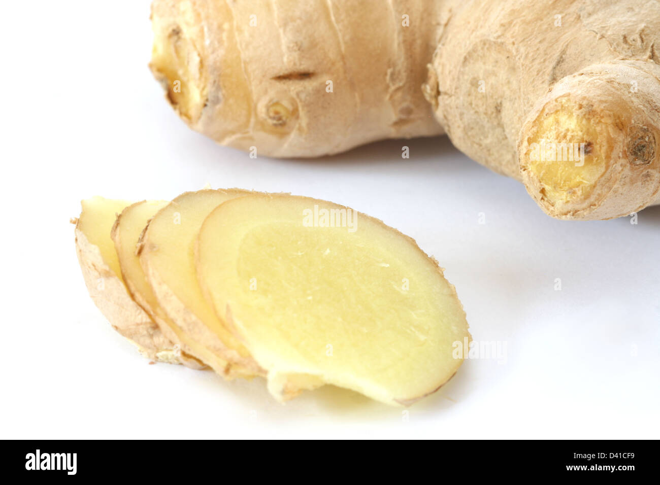 Whole raw ginger root piece with slises on white background Stock Photo ...