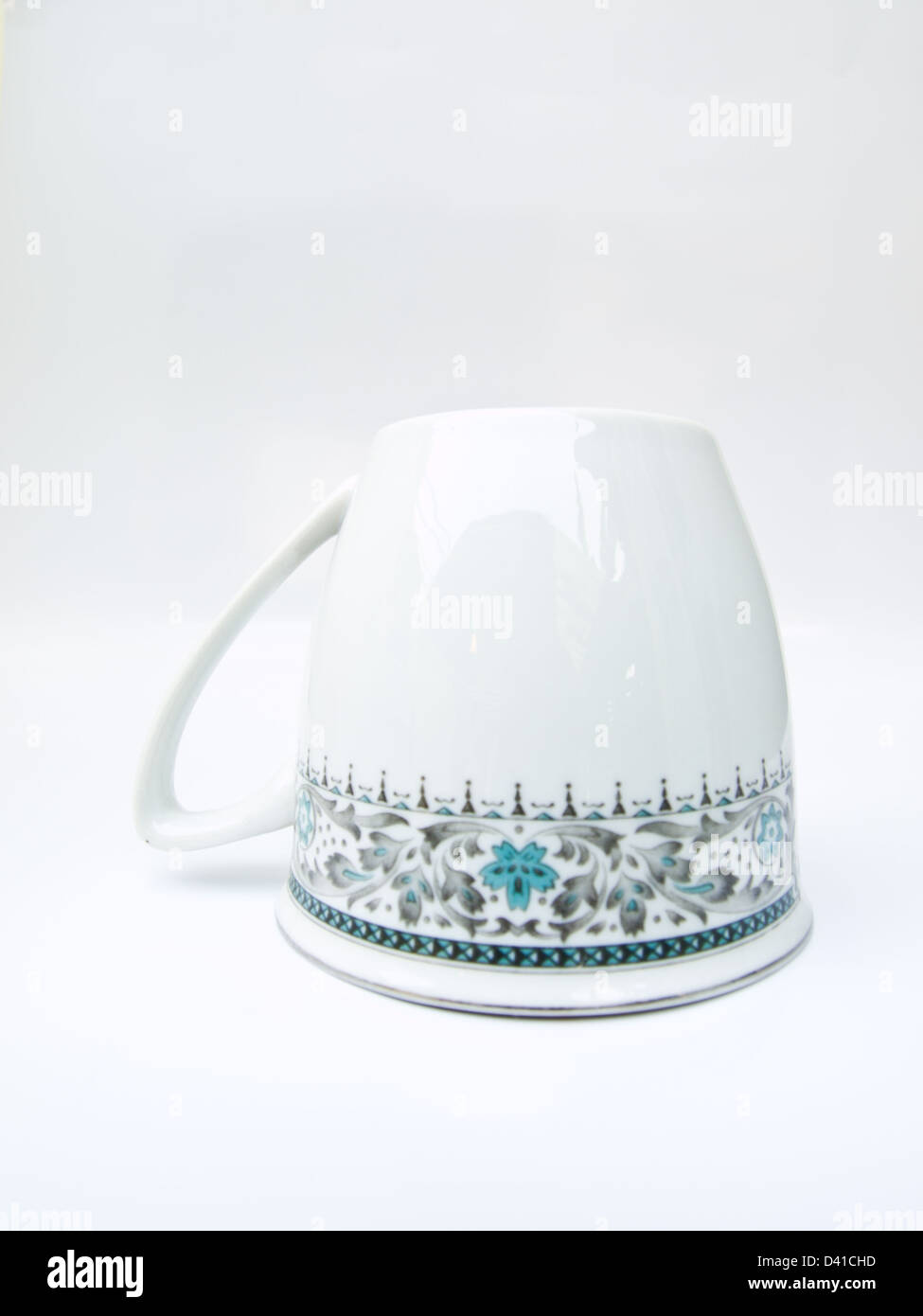 A floral pattern tea cup isolated on white background Stock Photo - Alamy