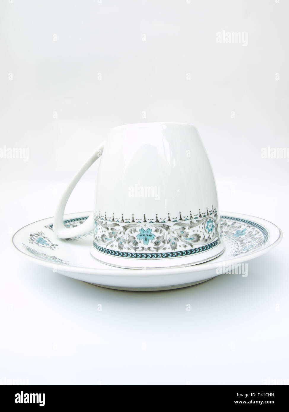 A floral pattern tea cup isolated on white background Stock Photo - Alamy