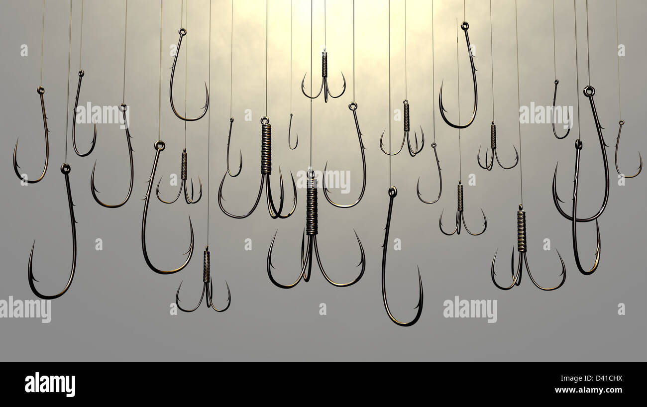 An array of fishing hooks in various sizes and shapes dangling on ...