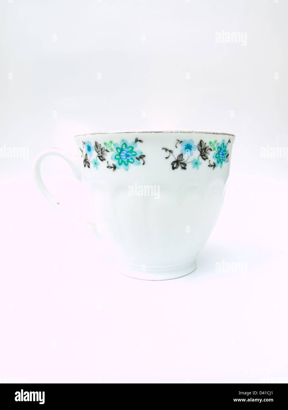 A floral pattern tea cup isolated on white background Stock Photo - Alamy