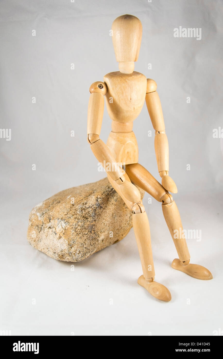 Dummy sitting on a rock. rest is important in modern life Stock Photo ...