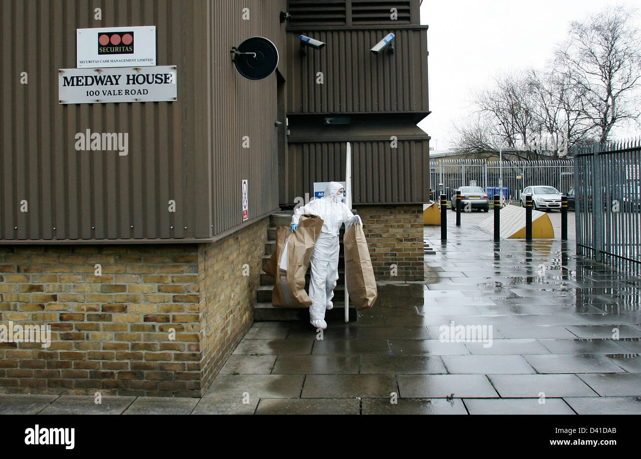 Police forensics officers at the scene of an armed robbery at the ...