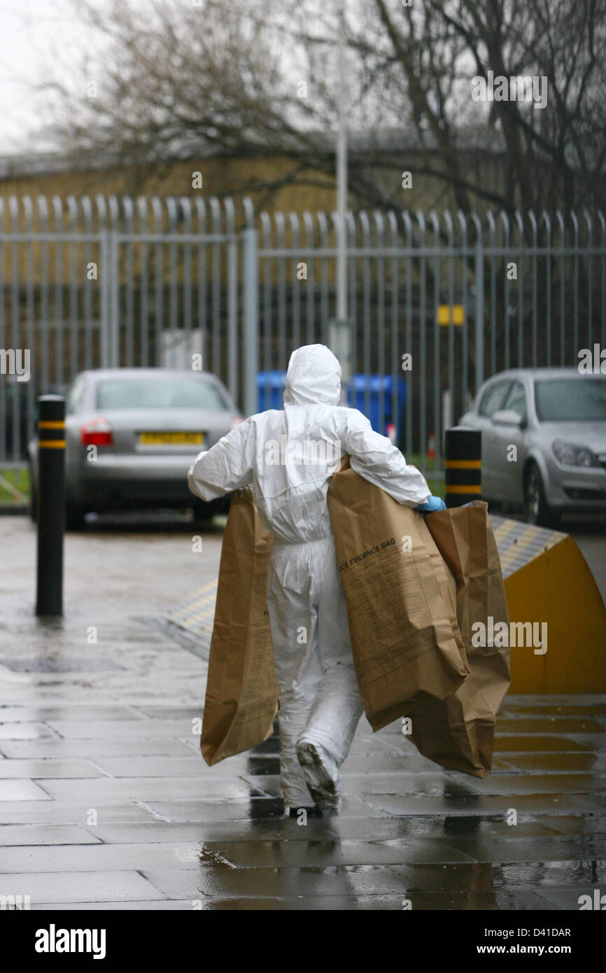 Police forensics officers at the scene of an armed robbery at the ...