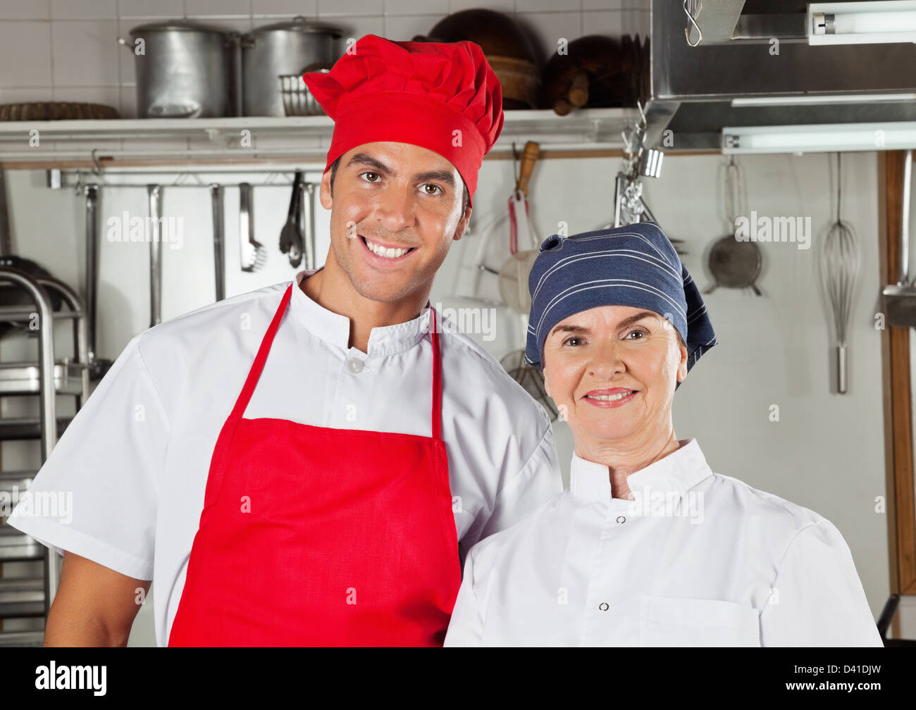 Confident Chefs In Kitchen Stock Photo - Alamy