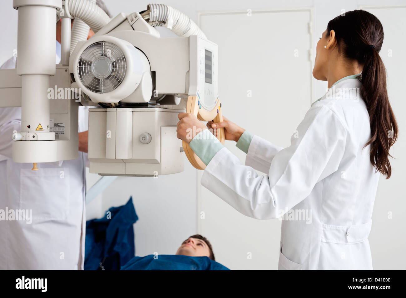 Female Radiologist Performing X-ray On Patient Stock Photo - Alamy