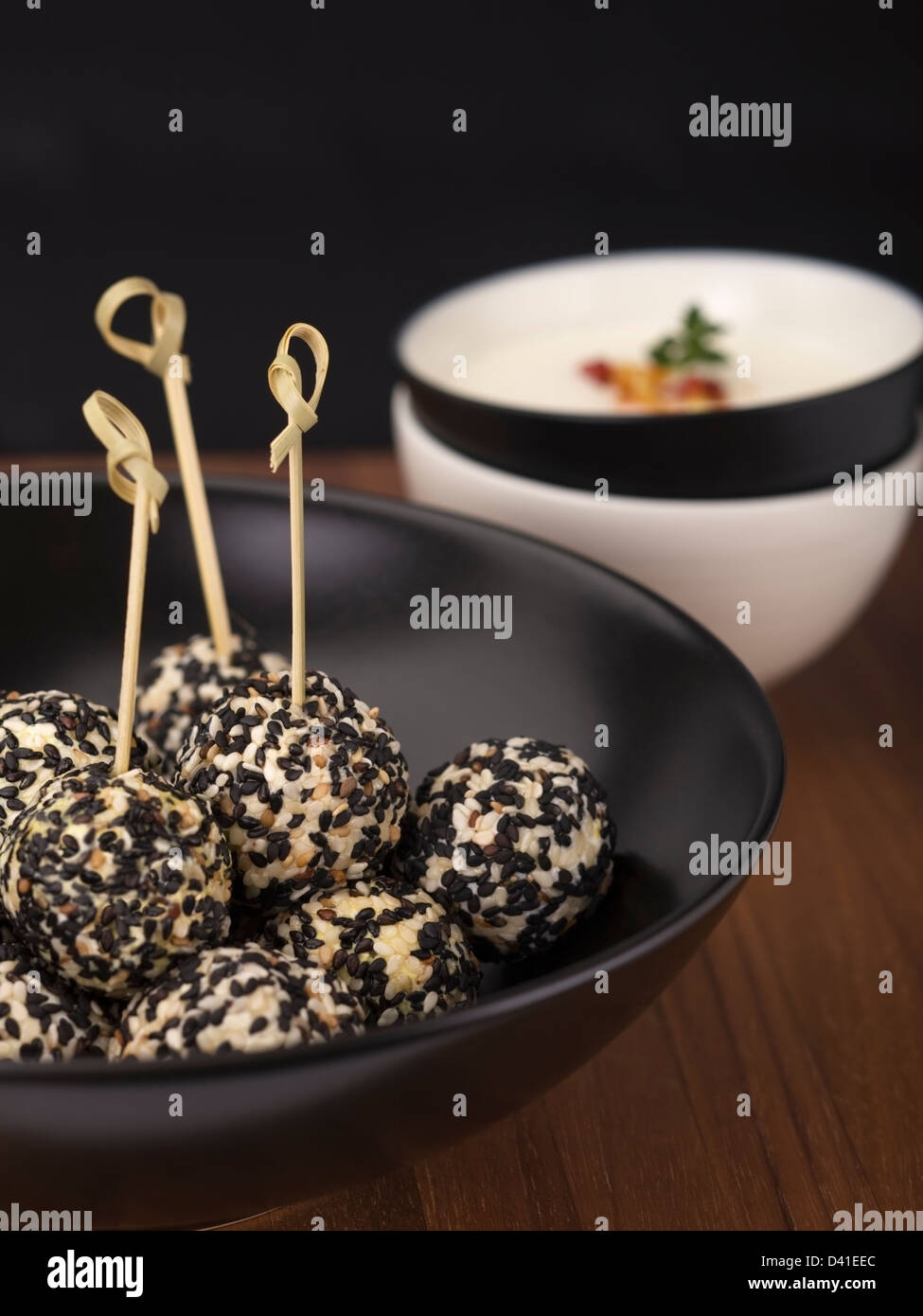 Spicy goat cheese balls rolled in sesame seeds Stock Photo - Alamy