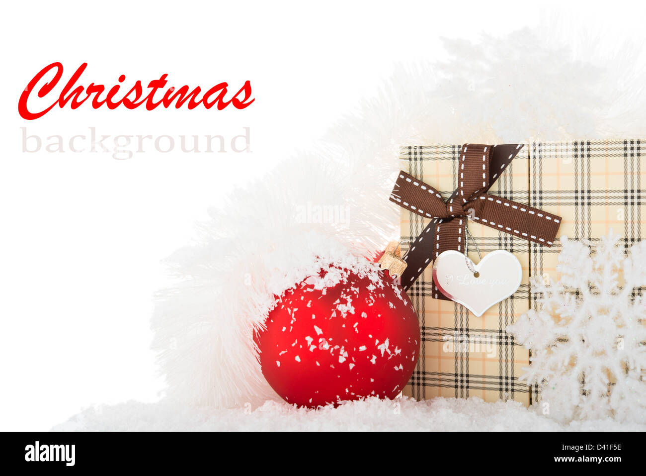 Gift box and Christmas tree decorations on a snow Stock Photo - Alamy