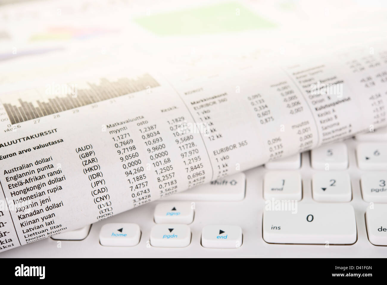 Newspaper on a white keyboard Stock Photo - Alamy