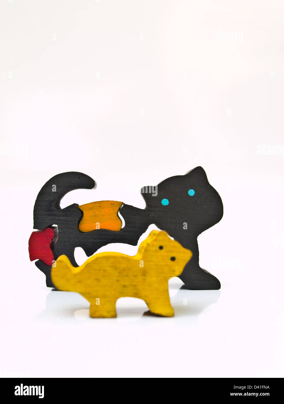Colorful wooden cats puzzle isolated on white background Stock Photo ...