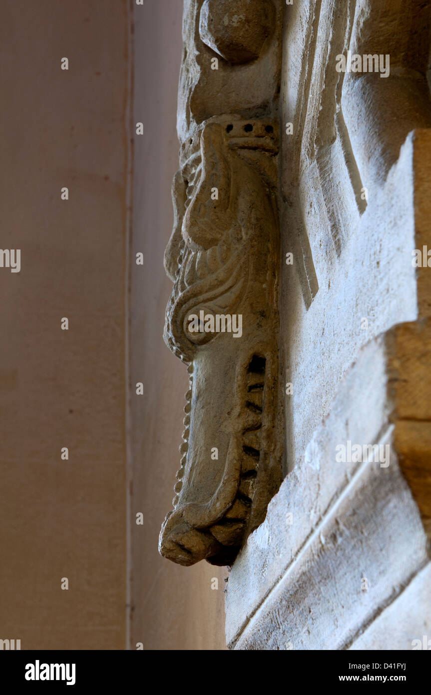 Dragon`s head carving in St. John the Evangelist Church, Elkstone ...