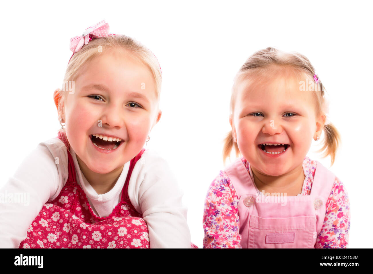 studio shot of two laughing sisters Stock Photo - Alamy
