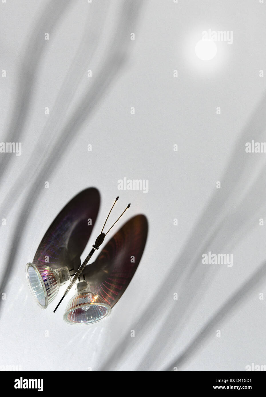 butterfly, which is made of light bulbs,flies to the sun Stock Photo ...