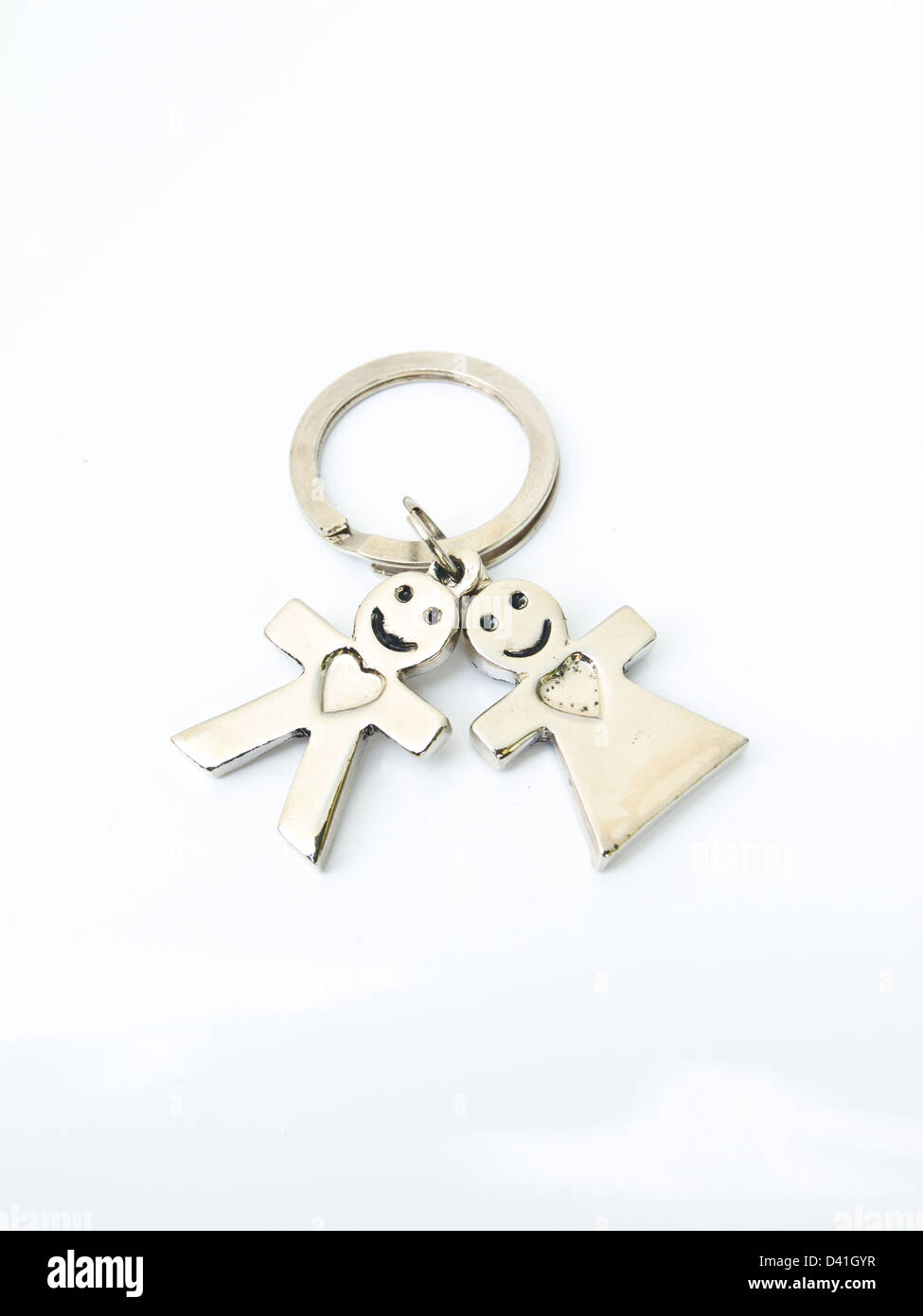 Metallic couple key-chain isolated on white background Stock Photo - Alamy