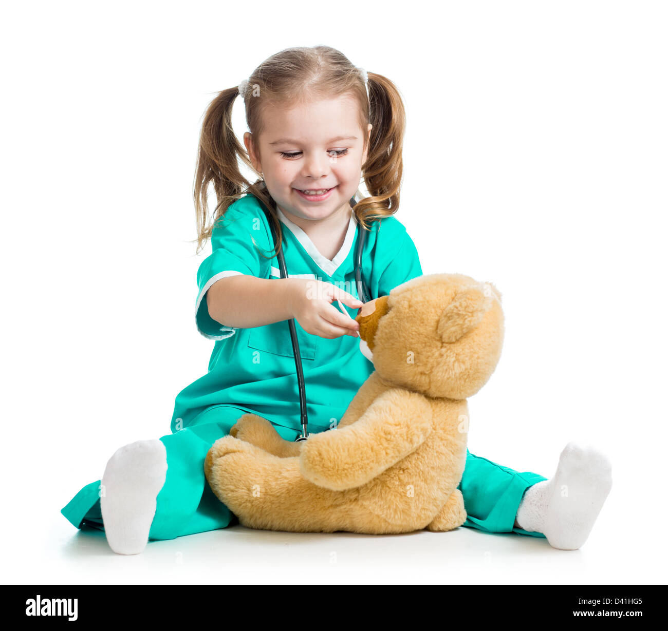 Adorable child with clothes of doctor and teddy bear over white Stock ...