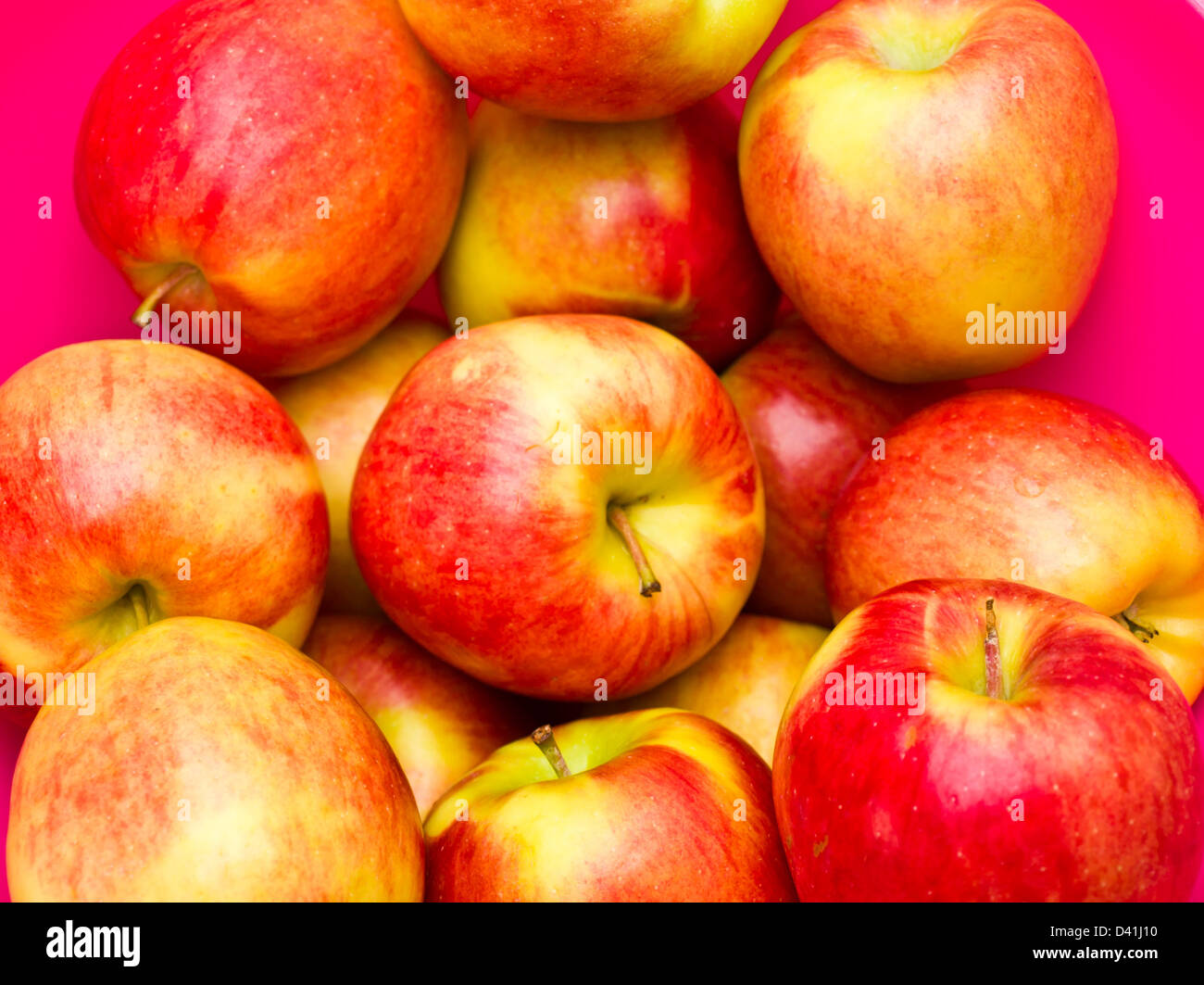 Red apples isolated on pink Stock Photo - Alamy