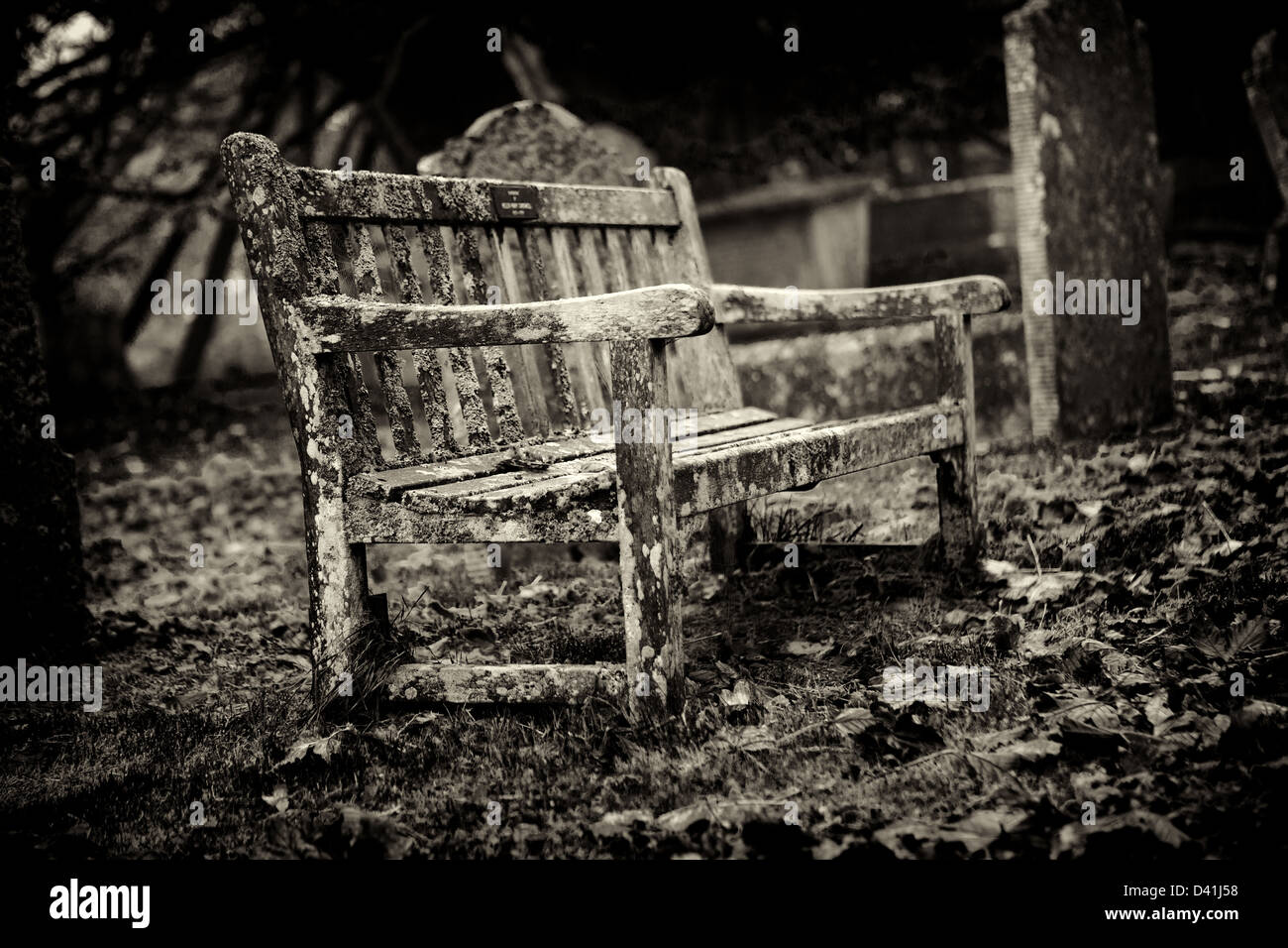 An old wooden bench in an English Churchyard Stock Photo - Alamy