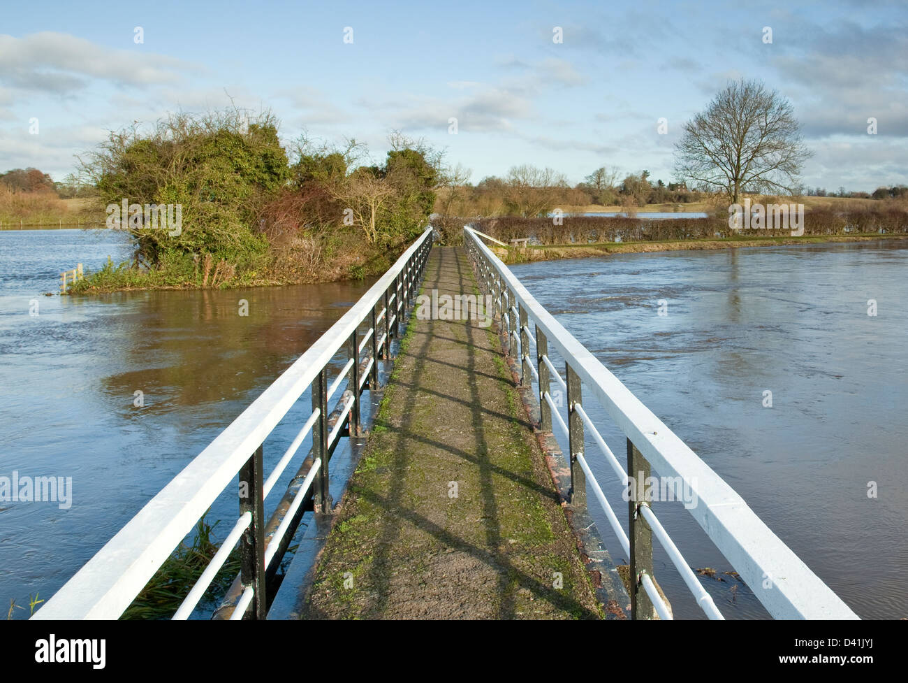 Footbridge over severe flooding from the rising river trent in Alrewas ...