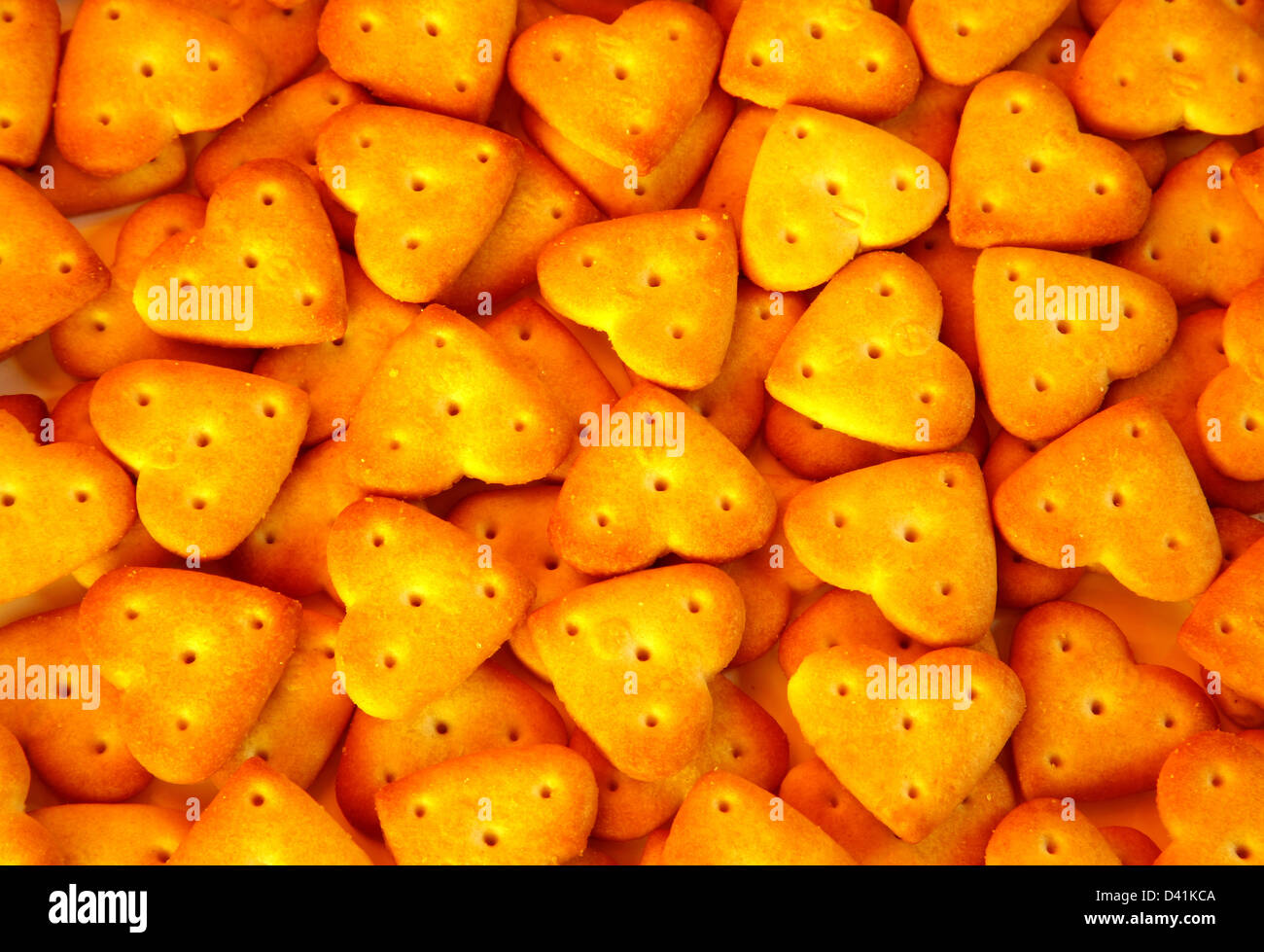 Heart-shaped crackers background Stock Photo - Alamy