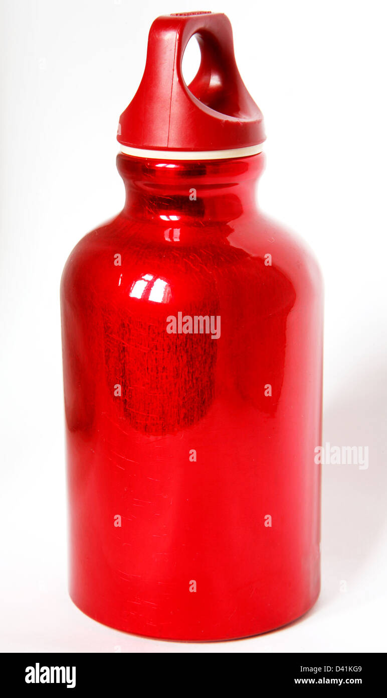 Red metallic bottle on white background Stock Photo - Alamy